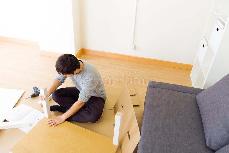 Asian Man Assembling New Cupboard Stock Image - Image of move, combine ...