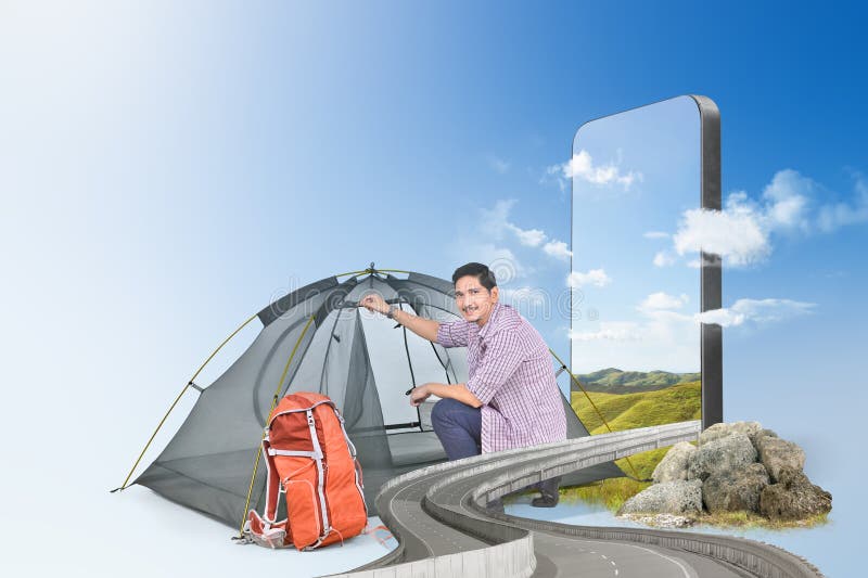 Asian Man with a Backpack Setting Up a Tent with a Hill View on the ...