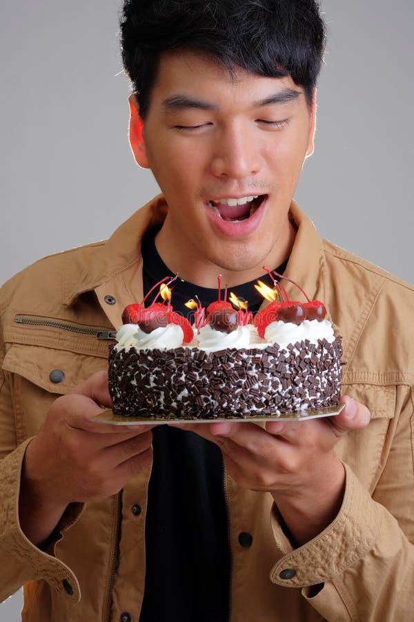 Asian Man with Birthday Ice-cream Cake on Fire Stock Photo - Image of ...