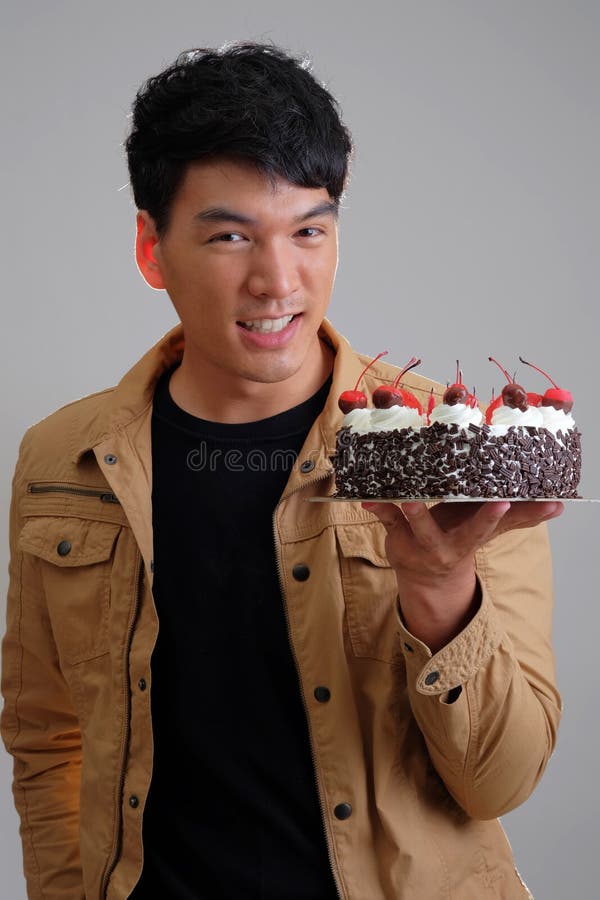 Asian Man with Birthday Ice-cream Cake on Fire Stock Photo - Image of ...
