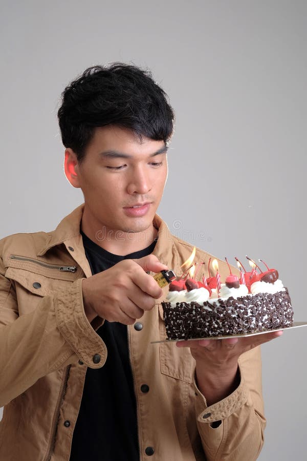Asian Man with Birthday Ice-cream Cake on Fire Stock Photo - Image of ...