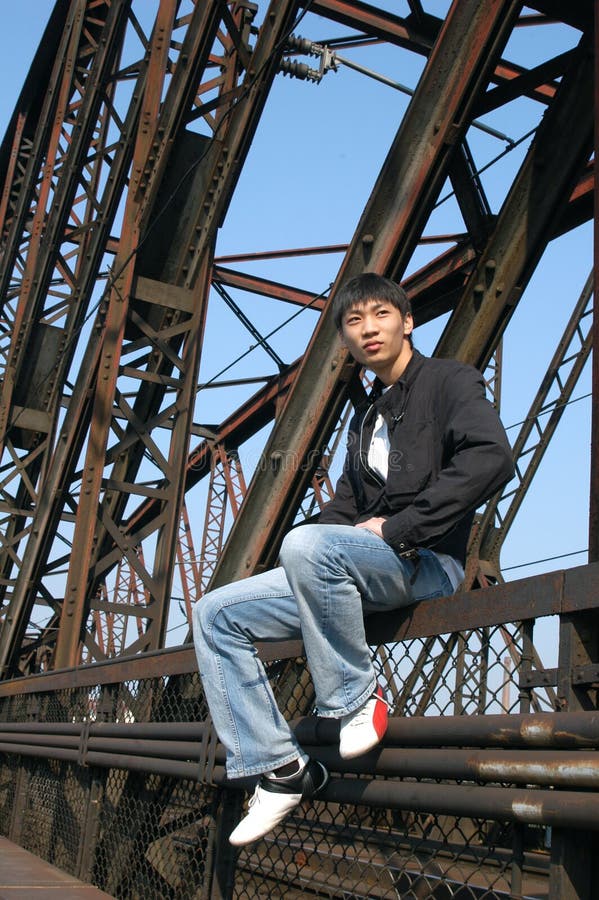 Asian Man on the Bridge stock photo. Image of handsome - 914822