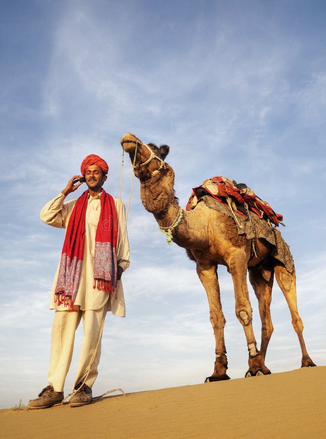 Asian Man and Camel in the Desert with Communications Stock Image ...