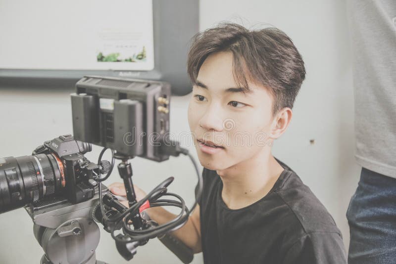 Asian man with camera stock photo. Image of equipment - 91760118