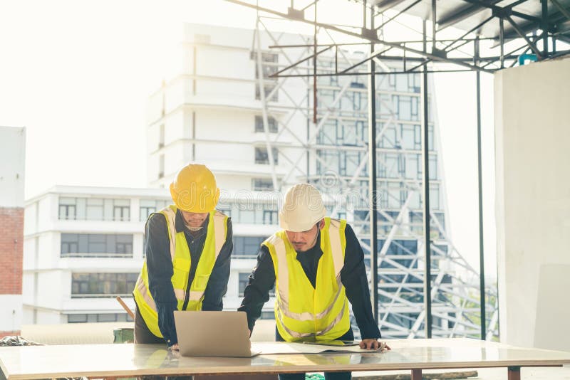 Asian Man Civil Engineer and Contractor Working with Computer Laptop on ...