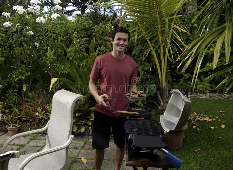 Asian Man Cooking a Barbecue Lunch Stock Photo - Image of outdoors ...