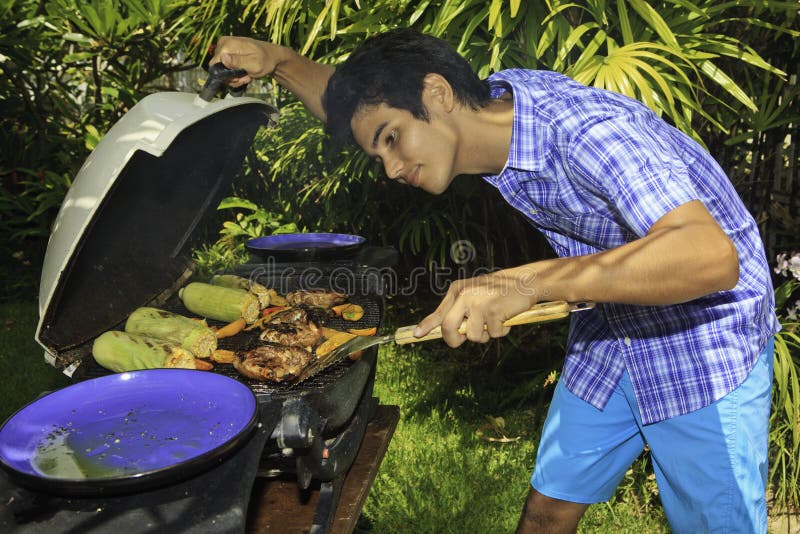 Asian Man Cooking on an Outdoor Grill Stock Image - Image of mixed ...