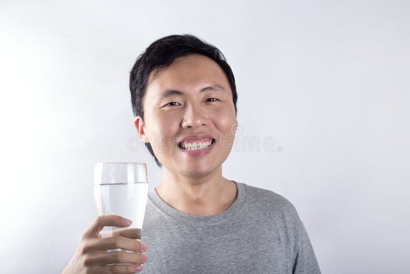 Asian man drinking water stock image. Image of person - 100479543