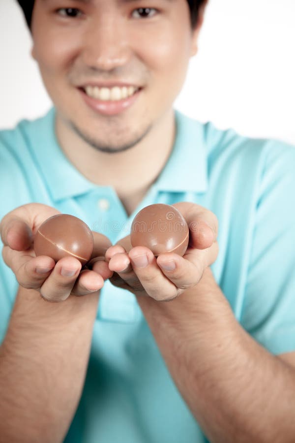 Asian man with easter eggs stock image. Image of giving - 51642357