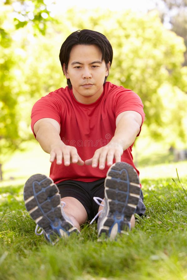Asian man exercising stock image. Image of leisure, toes - 55892325