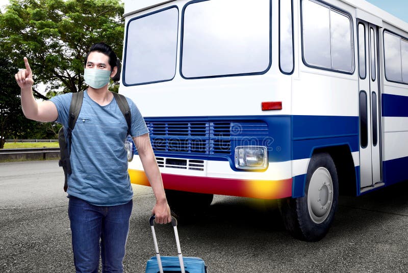 Asian Man in the Face Mask with Backpack and Suitcase on the Bus ...