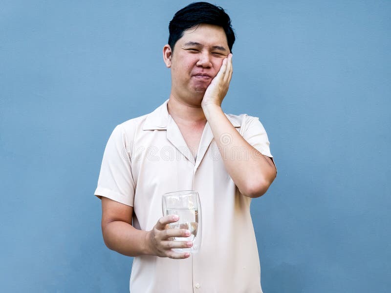 Asian Man Feel Sensitive Teeth after Drinking Cold. Dental Health ...