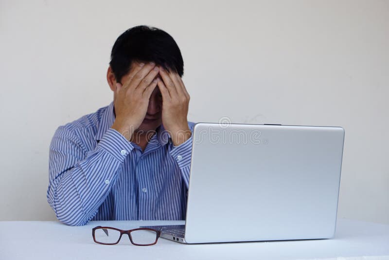 Asian Man Feels Stressed during Working on Laptop Computer. Stock Photo ...