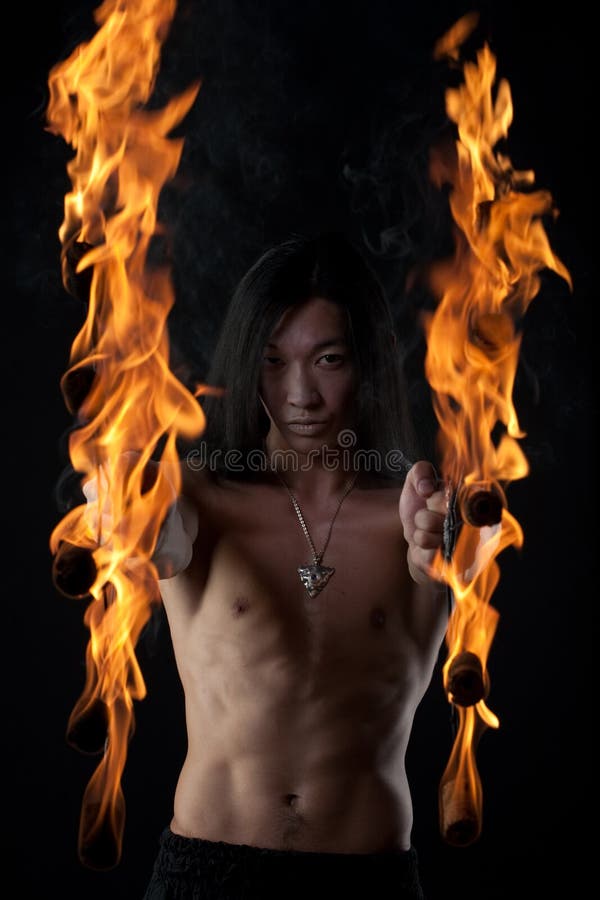 Asian man with fire show stock image. Image of maui, flaming - 10898283