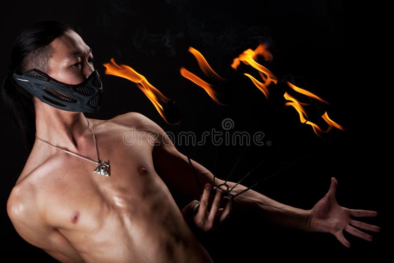 Asian man with fire show stock photo. Image of adult - 11111336