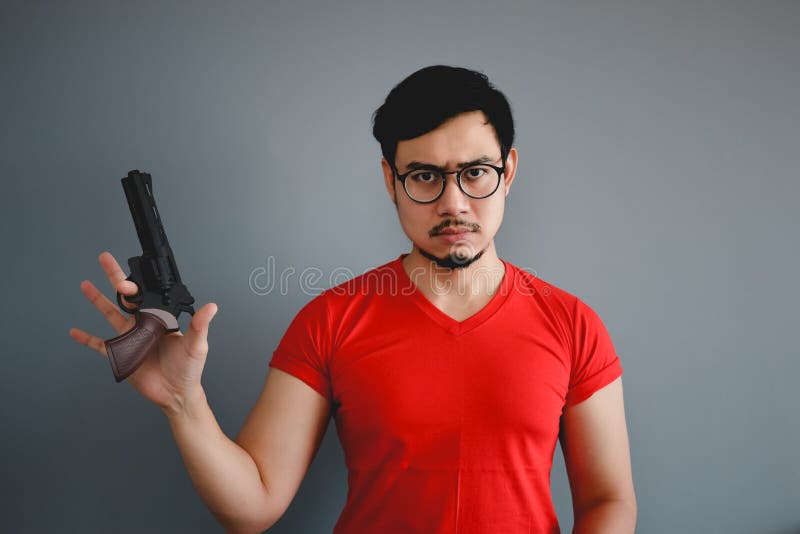 Asian man with a gun. stock photo. Image of attack, aiming - 59524700