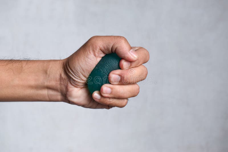 Hand of Asian, Chinese Man Gripping Hand Exercise Gripper Stock Image ...