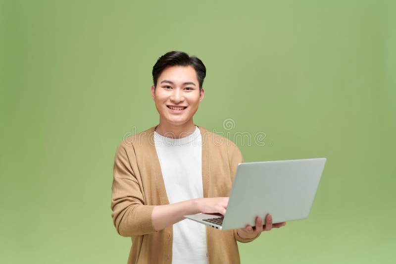 Asian Man Holding the Computer Stock Image - Image of asian, online ...