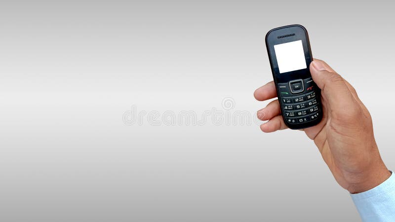 Asian Man Holding Feature or Keypad Phone in Hand Stock Image - Image ...