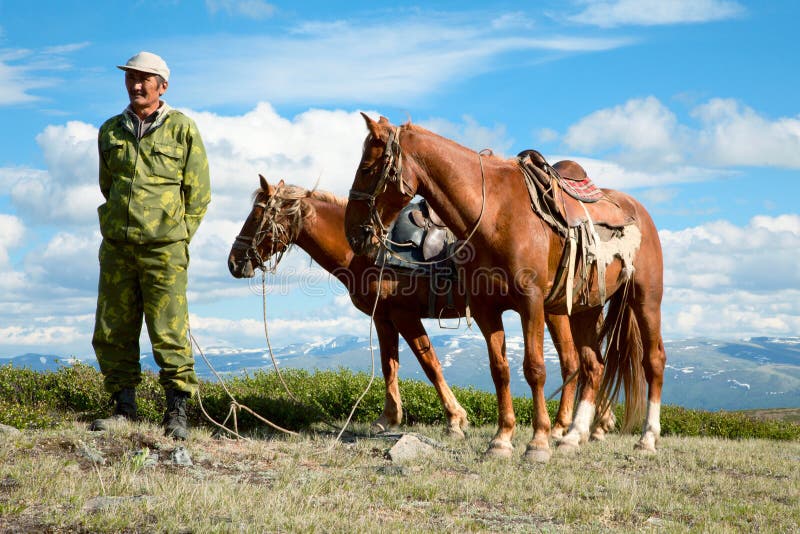 Asian Man Holding Two Horses Stock Photo - Image of blank, reins: 15916230