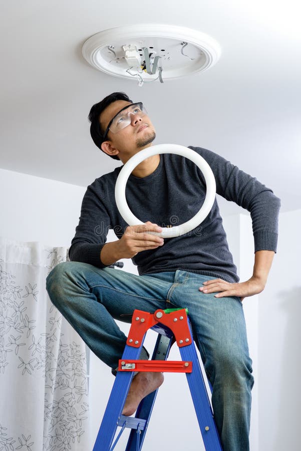 Installing light bulb stock photo. Image of labor, electrical - 167103142