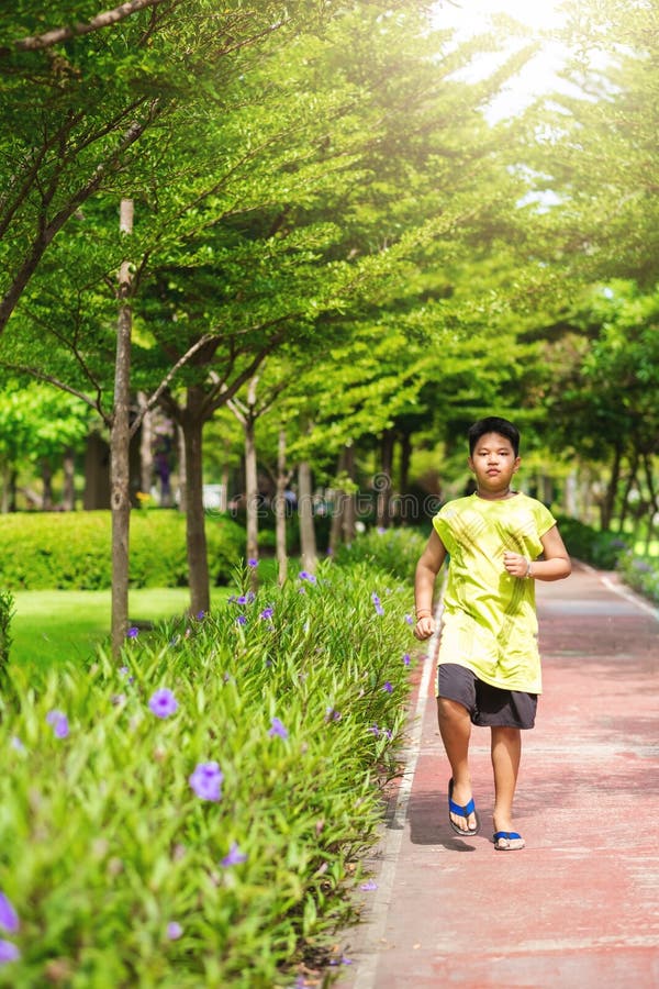 Asian Man Jogging at the Park in Sunny Morning. Stock Image - Image of ...