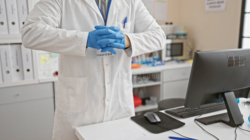 Asian Man in Lab Coat and Gloves Standing in a Laboratory with Computer ...