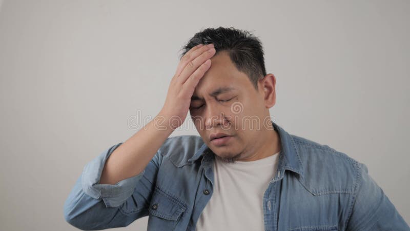 Asian Man Looking at Camera with Sad and Regret Expression ...