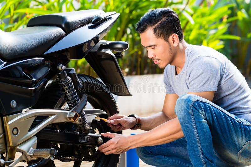 Asian Man at Motorcycle Maintenance Stock Image - Image of tropics ...