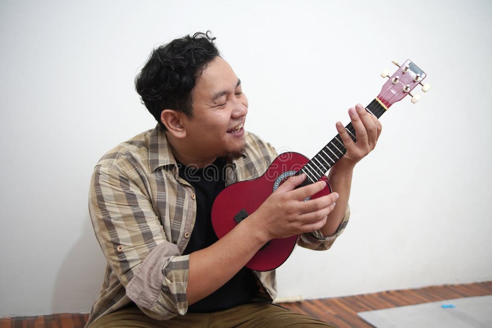 Asian Man Playing Ukulele at Home Stock Image - Image of ukulele ...