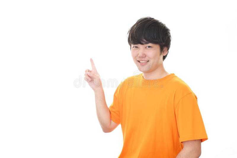 Asian man pointing stock image. Image of attractive - 126979829