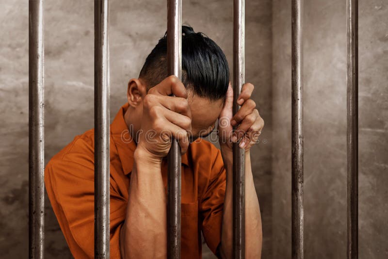 Asian man in prison alone stock photo. Image of pain - 95803378