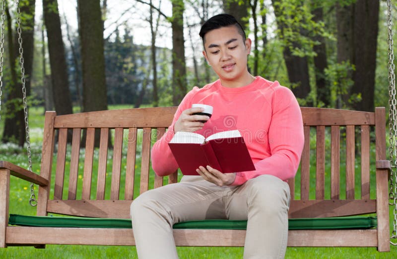 Asian Man Reading Book in Garden Stock Image - Image of parent, rest ...