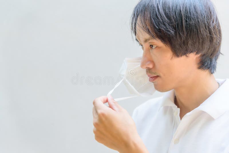 A Asian Man Remove the N95 Mask Stock Image - Image of hygienic, focus ...