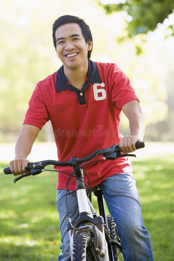 Asian Man Riding Bike in Park Stock Image - Image of casual, ethnicity ...