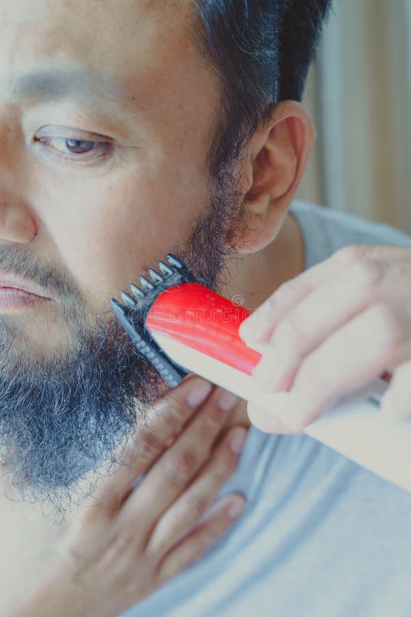 Asian Man Shaving Beard with Electric Razor Machine Stock Image - Image ...