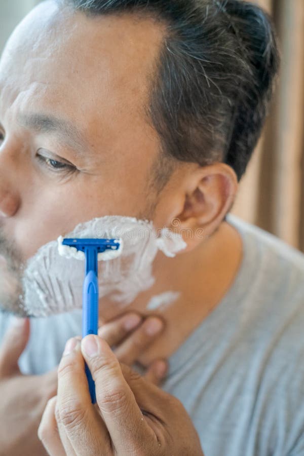 Asian Man Shaving Beard with Razor Stock Photo - Image of human, beard ...