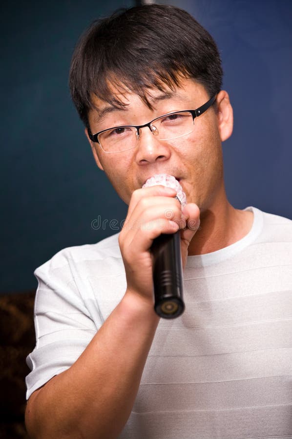 Asian man singing stock image. Image of male, karaoke - 15546591