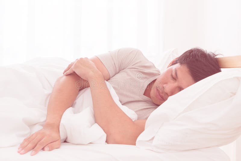 Asian Man Sleeping Side Way on White Bed Stock Image - Image of room ...
