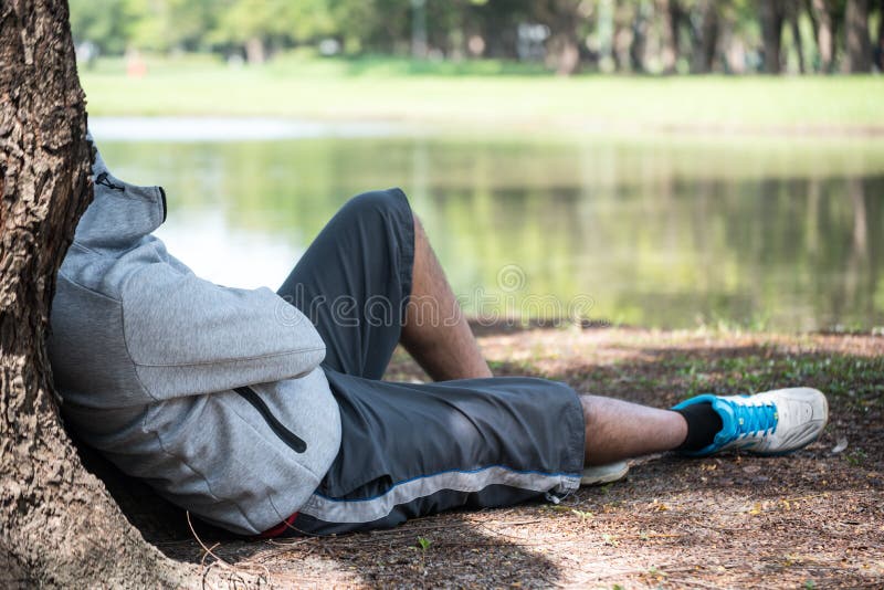 Asian Man Sleeping Under a Tree after Exercise Stock Image - Image of ...