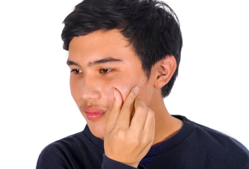An Asian Man is Squeezing Acne on His Face. Stock Image - Image of ...