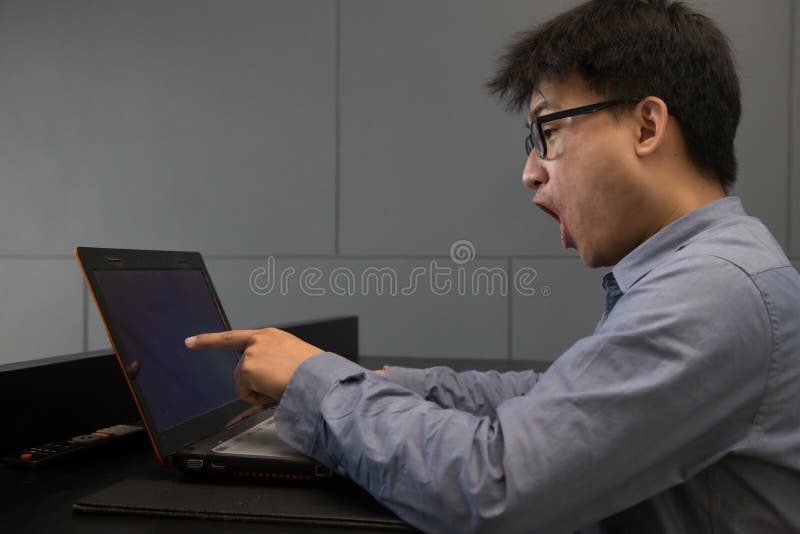 Asian Man Surprised with Laptop Computer Stock Image - Image of victory ...
