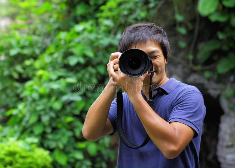 Asian man taking photo stock image. Image of japanese - 31975079