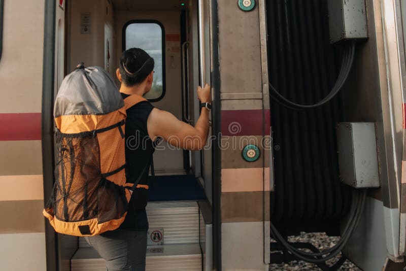 Man Tourist Backpacker Getting into the Train Stock Image - Image of ...