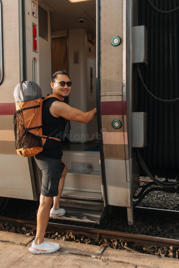 Man Tourist Backpacker Getting into the Train Stock Photo - Image of ...