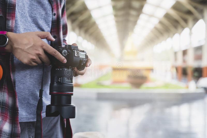 Asian Man Traveler with Backpack Holding Camera in Train Station Stock ...