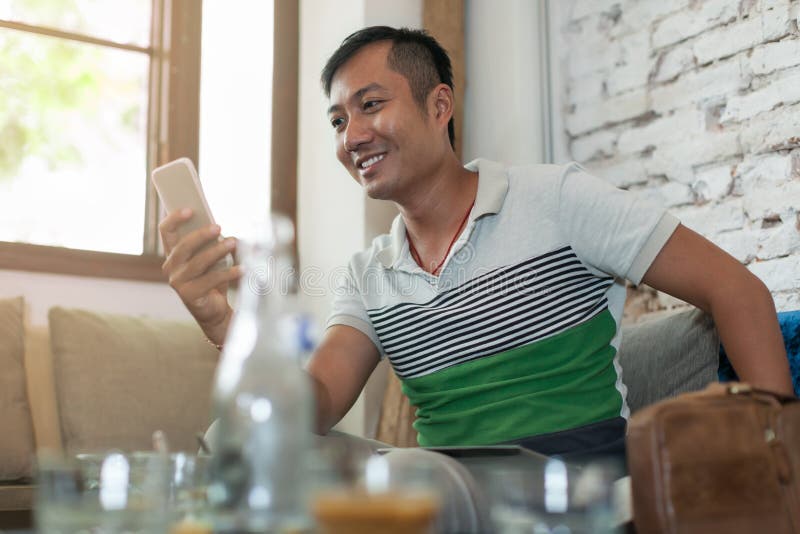 Asian Man Using Cell Phone Smile Sitting Cafe Stock Photo - Image of ...