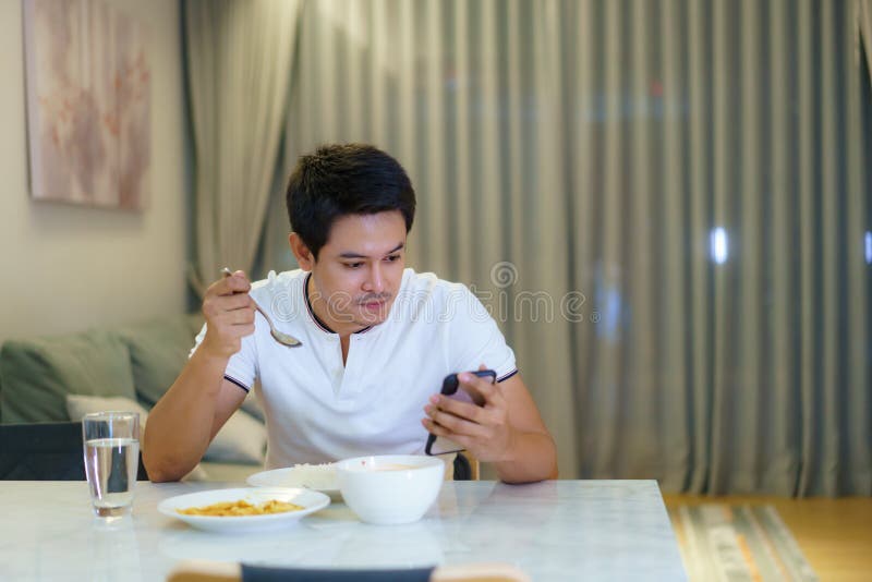 Using Cell Phone Night Eating Stock Photos - Free & Royalty-Free Stock ...