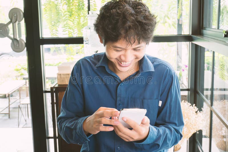 Asian man using smartphone stock image. Image of smart - 102367583