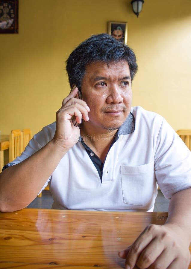 Asian man using smartphone stock image. Image of call - 40133225